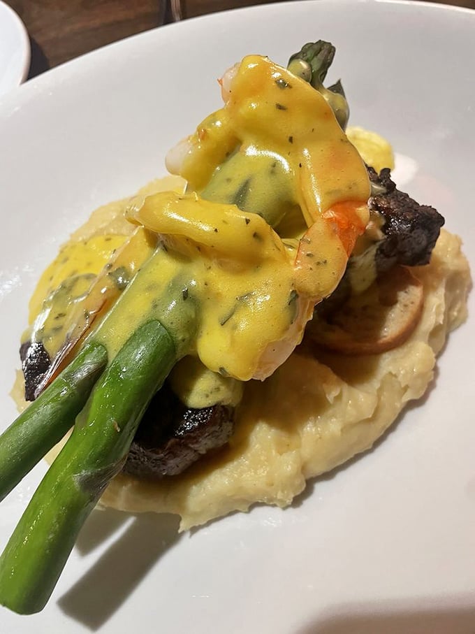 Steak Christopher isn't just a meal&mdash;it's filet mignon living its best life under a golden b&eacute;arnaise waterfall.