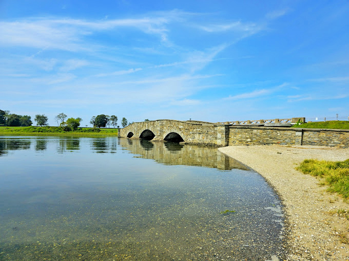 This charming stone arch bridge could convince you you've wandered into a fairy tale. Engineering meets artistry in this picturesque crossing.