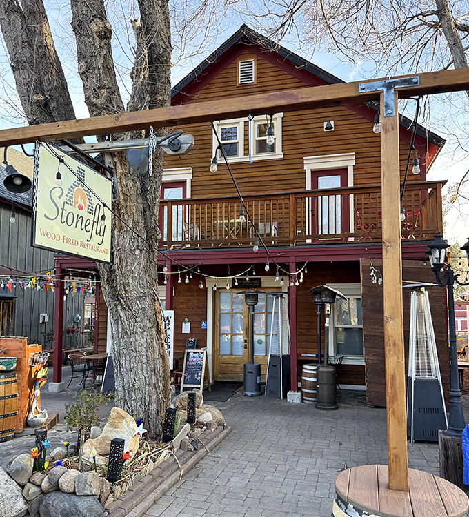 The Stonefly &ndash; where mountain cuisine meets front porch charm. The string lights aren't just decoration; they're an invitation to linger as twilight falls.