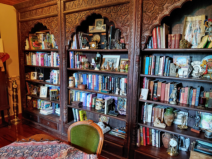 Bibliophiles rejoice! This ornately carved bookcase houses treasures bound in leather and cloth &ndash; a medieval library for modern-day dreamers.