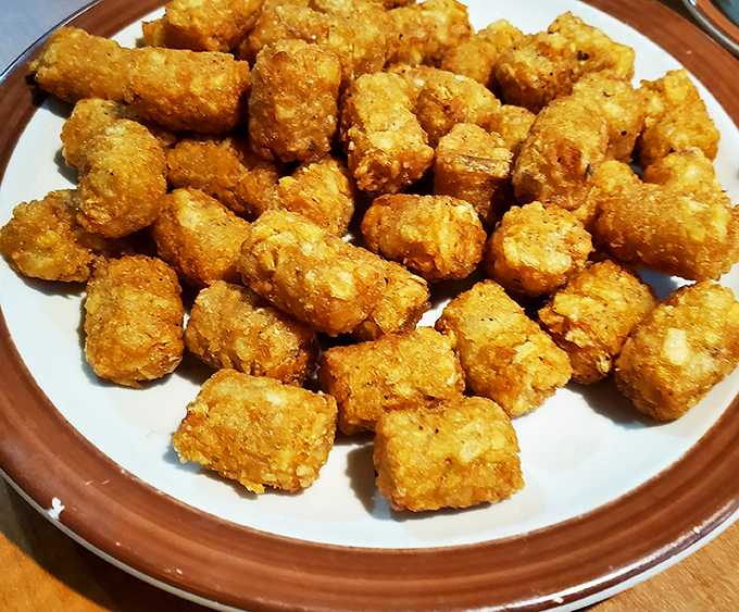 These golden-brown tater tots aren't just side dishes&mdash;they're little nuggets of potato perfection that could start their own cult following. 