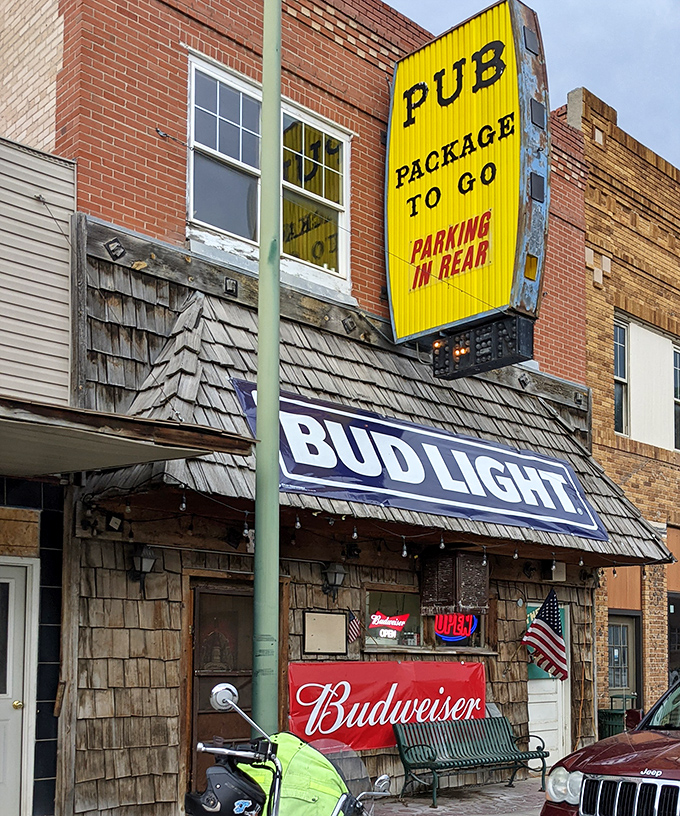 The Pub's weathered wooden exterior and neon beer signs tell you everything you need to know&mdash;this is where stories flow as freely as the drinks.