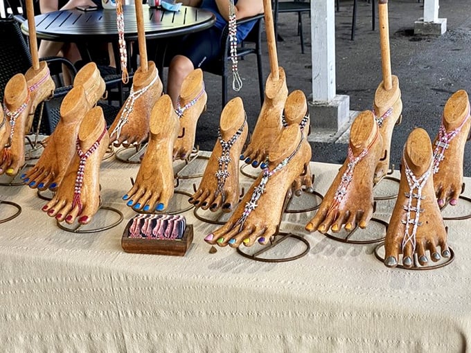 Not your average flip-flops &ndash; these wooden foot sculptures with beaded embellishments elevate beach footwear to conversation-starting art.