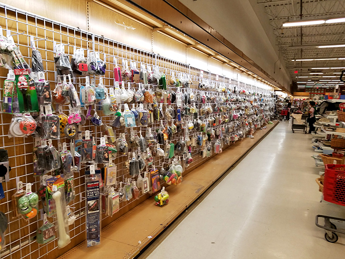 The wall of packaged toys looks like Santa's workshop after an organizing seminar&mdash;neatly displayed potential gifts for every occasion.