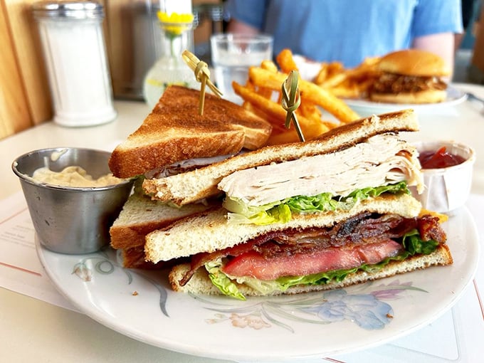 A club sandwich that belongs in the Sandwich Hall of Fame. Perfectly stacked, precisely cut, with sides that aren't just an afterthought.