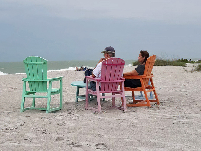 Colorful Adirondack chairs await beach philosophers. The perfect front-row seats to nature's greatest show&mdash;the Gulf of Mexico at play.