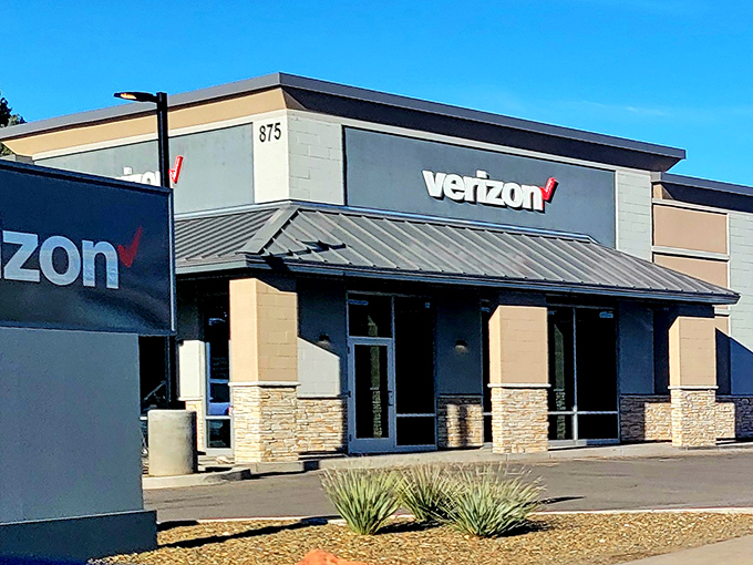 Even the Verizon store fits the local aesthetic, proving good design transcends corporate branding requirements.
