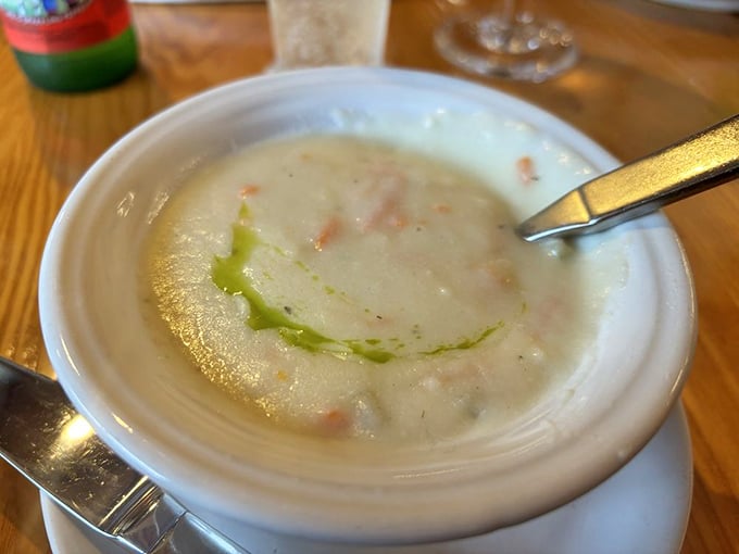 Vermont cheddar soup that's basically a warm hug in a bowl, with a swirl of herb oil for that perfect finishing touch.