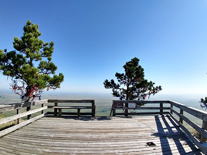 The summit's wooden deck offers the ultimate panoramic reward&mdash;like standing on the edge of forever with South Dakota spread beneath you.