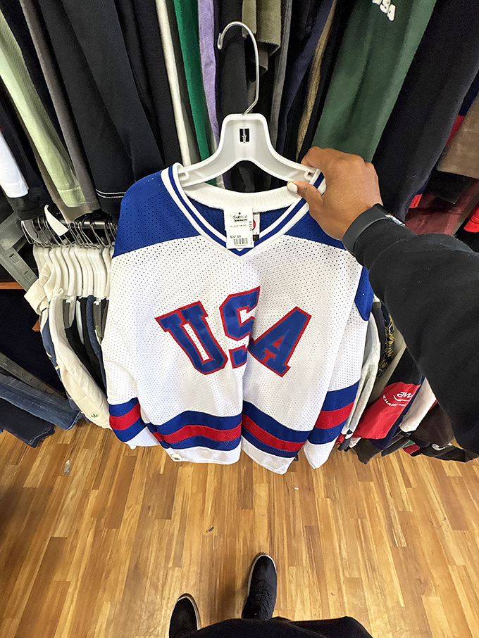 That vintage USA hockey jersey hanging there is basically patriotism meets affordability in one glorious mesh package.