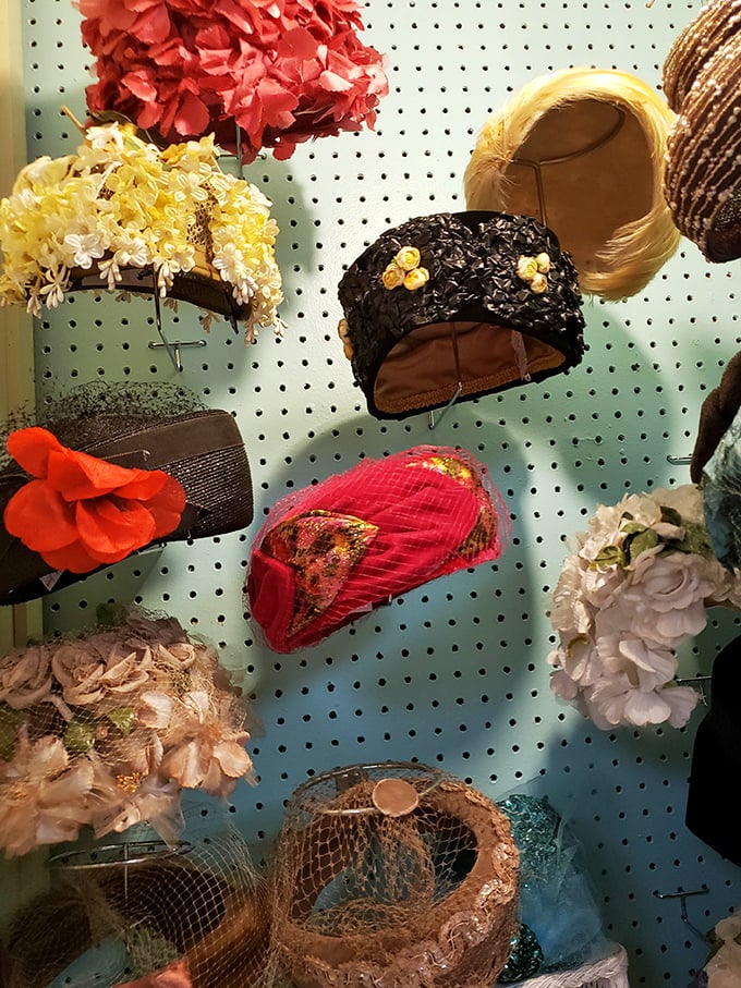 A pegboard gallery of vintage millinery &ndash; each hat with its own personality and story, waiting for the right head to continue its journey.