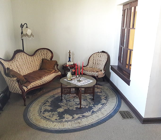 Victorian furnishings meet Mediterranean dreams in a sitting area that proves eclecticism is severely underrated in home design.