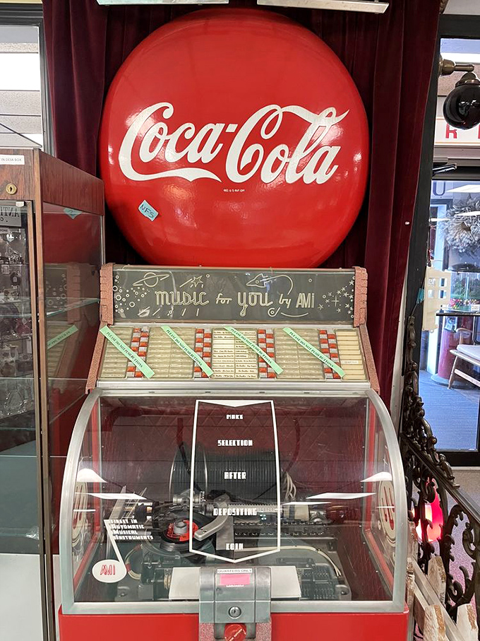 A vintage Coca-Cola sign crowns a jukebox that once soundtracked teenage romances and first dates across small-town America.