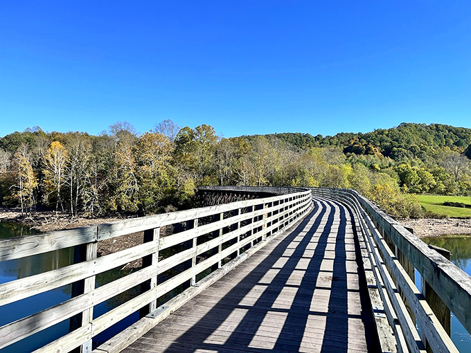 The Virginia Creeper Trail's wooden bridges carry cyclists and hikers over rushing waters, offering views that no smartphone camera can truly capture.