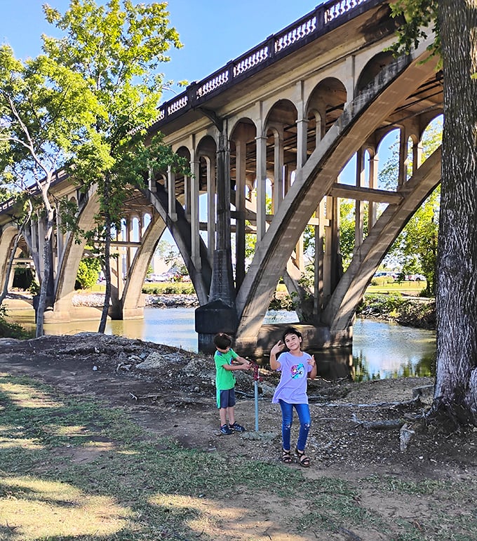 Under this magnificent arched bridge, childhood curiosity flows as freely as the Coosa River&mdash;some engineering marvels double as playgrounds.