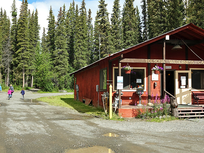 Wilderness hospitality at its finest. Tolsona's rustic cabin welcomes adventurers with hanging flower baskets&mdash;because even in the wilderness, aesthetics matter.