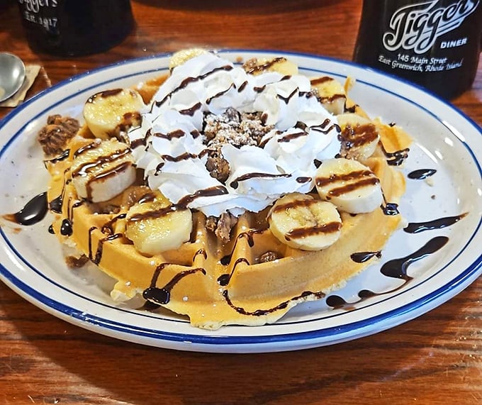 A waffle that's dressed for success with bananas, whipped cream, and chocolate drizzle. Breakfast or dessert? The line deliciously blurs.