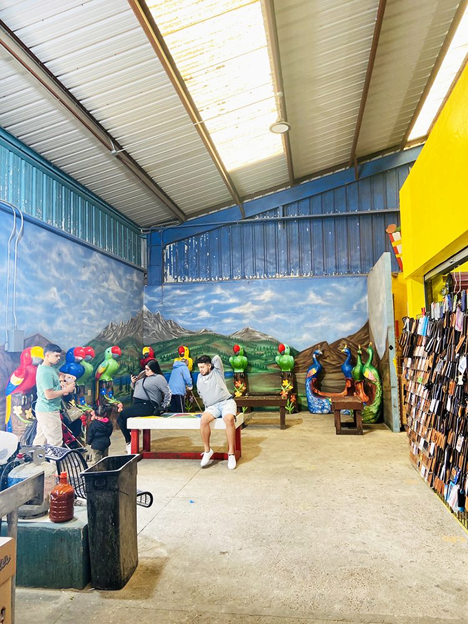 Photo-op paradise where colorful parrot benches create the perfect Instagram moment. Nature meets kitsch in this oddly charming rest area for weary shoppers. 