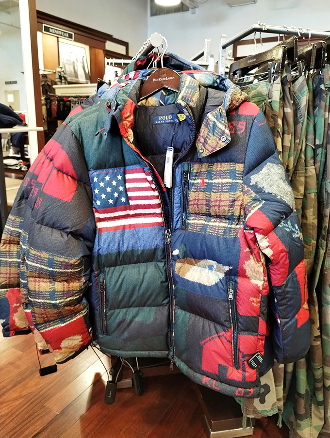 The patchwork jacket that screams "I have opinions about bourbon." Ralph Lauren's American flag design somehow makes patriotism look both rugged and luxurious.