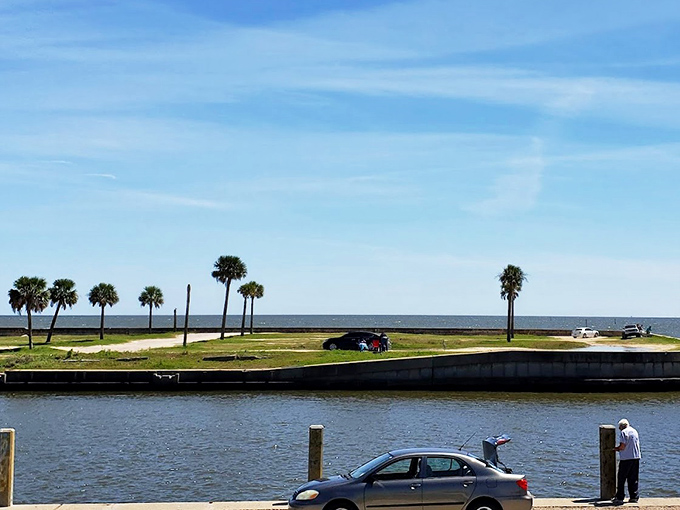 Palm trees frame the perfect beach day, where the lighthouse plays eternal lifeguard to Mississippi's coastal playground.