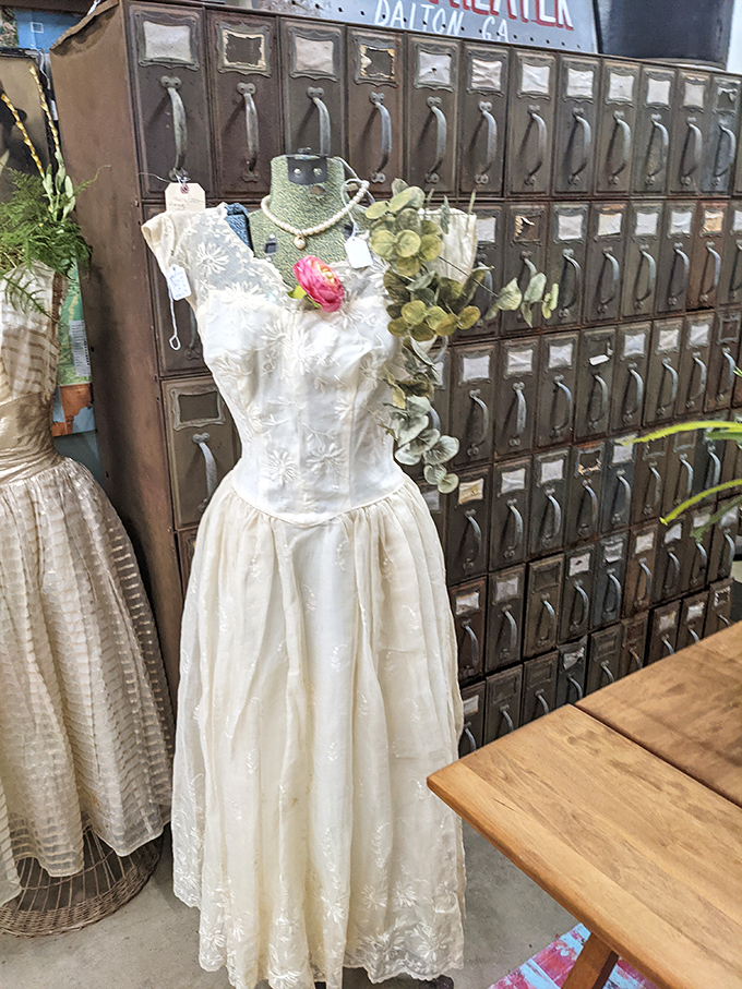 This vintage wedding dress stands sentinel against an antique filing cabinet&mdash;romance meets practicality in the most Tennessee way possible. 