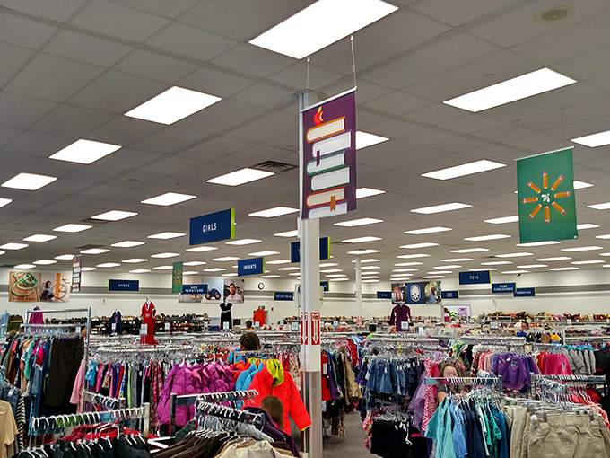 Department signs hover like friendly clouds above a sea of clothing&mdash;each aisle a new adventure in affordable fashion.