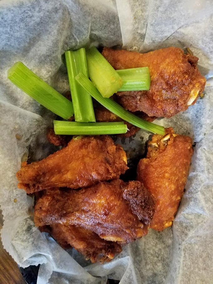 Buffalo wings with celery sticks&mdash;nature's perfect partnership. These crispy, saucy delights are worth every napkin you'll need afterward. 