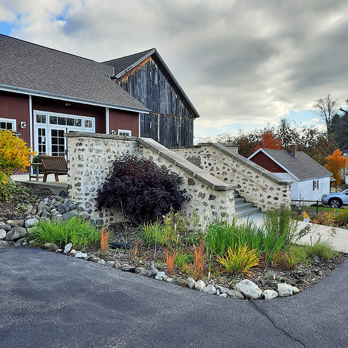 Stone bridges at Cedar Creek Settlement create Instagram-worthy backdrops without requiring filters or desperate posing for validation.