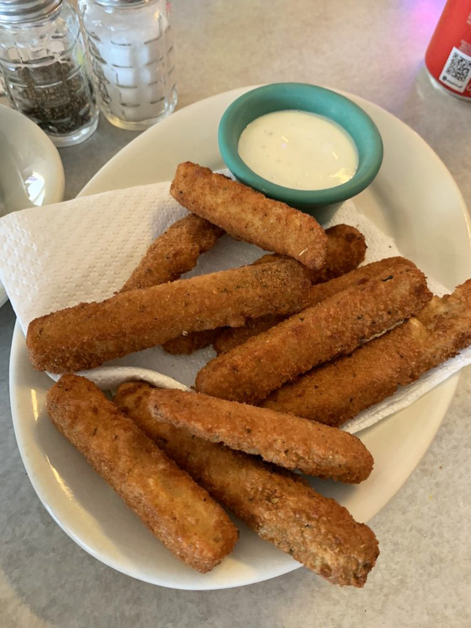 Crispy zucchini sticks with ranch dressing—proof that vegetables can be fun when they take a dip in the fryer.