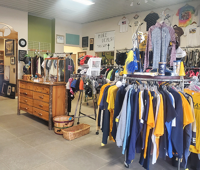 "More Deals!" indeed. The sign speaks truth in this corner where vintage dresser meets modern athletic wear in perfect thrift harmony.