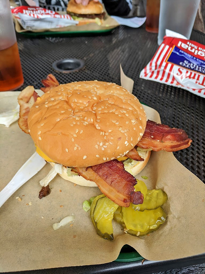 When bacon enters the burger equation, resistance becomes futile. Those crispy strips aren't just toppings; they're flavor exclamation points.