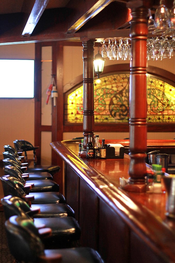 The bar area's stained glass and polished wood create a captain's quarters vibe. You half expect to hear sea shanties break out between cocktail orders.