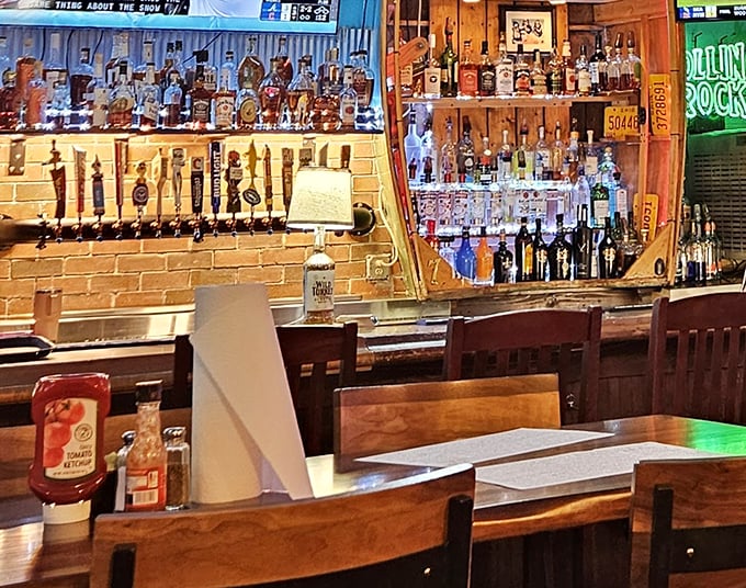 The bar area gleams with promise, its impressive lineup of bottles suggesting that whatever your spirit of choice, Mike's Place has you covered.