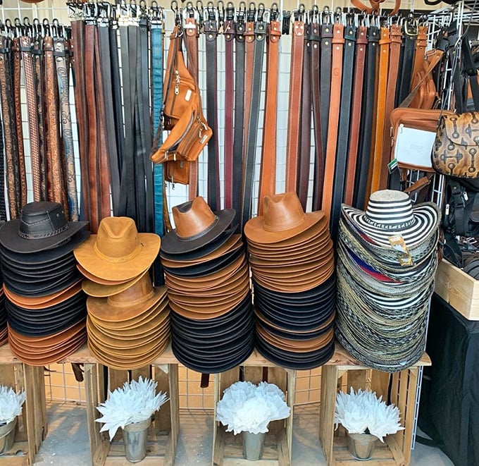 Leather goods and hats stacked high enough to outfit a small western town.