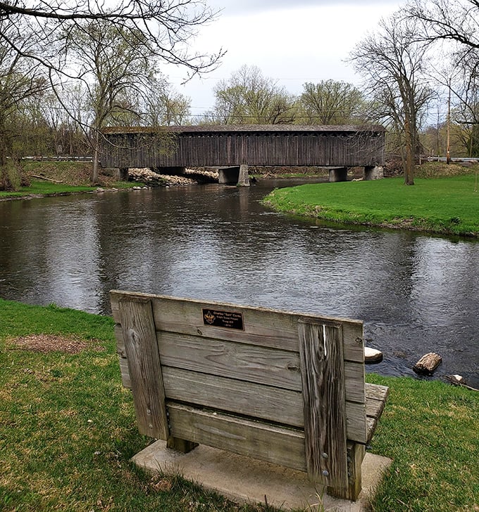 This rustic bench offers the best seat in the house—a front-row view of Wisconsin history spanning the gentle flow of Cedar Creek.