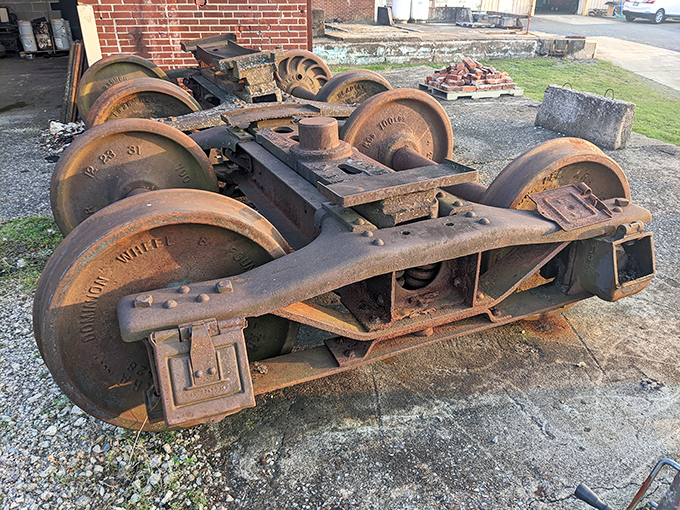 These massive steel wheels once thundered across Pennsylvania, their rust-colored patina telling stories of countless miles traveled.