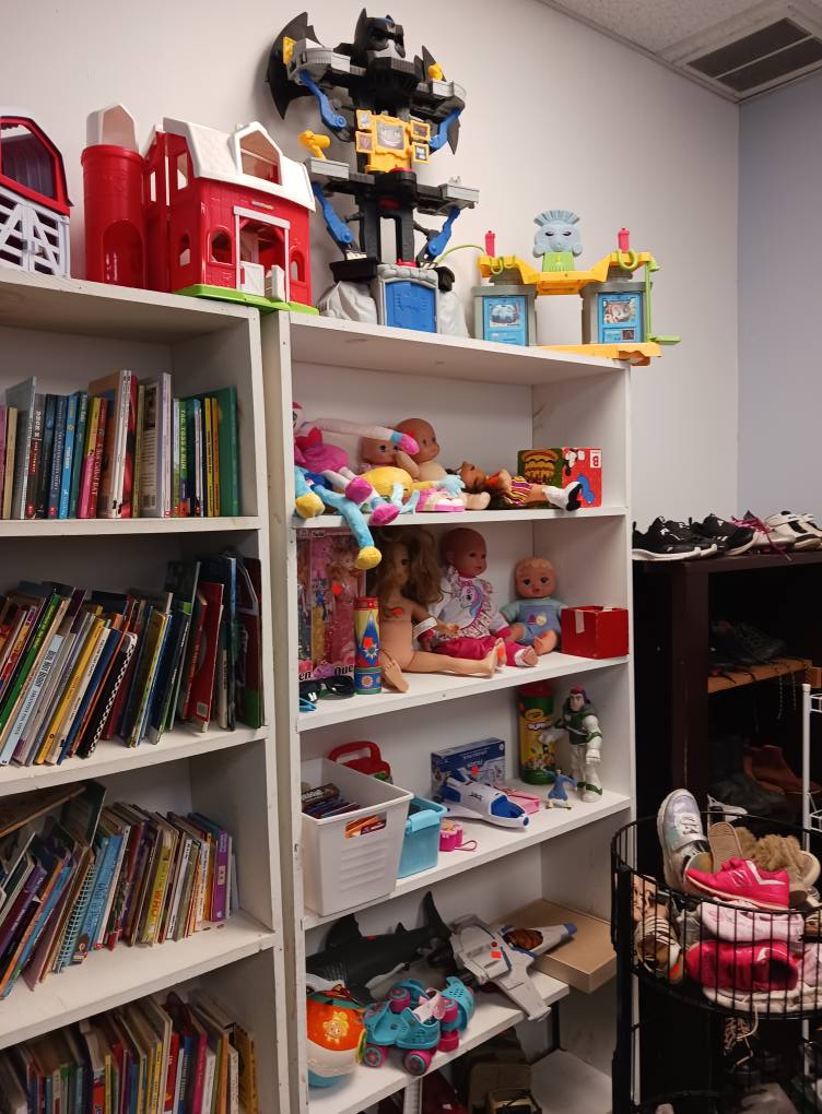 Childhood memories line these shelves. From colorful picture books to vintage toys, nostalgia is the real bargain in this corner.