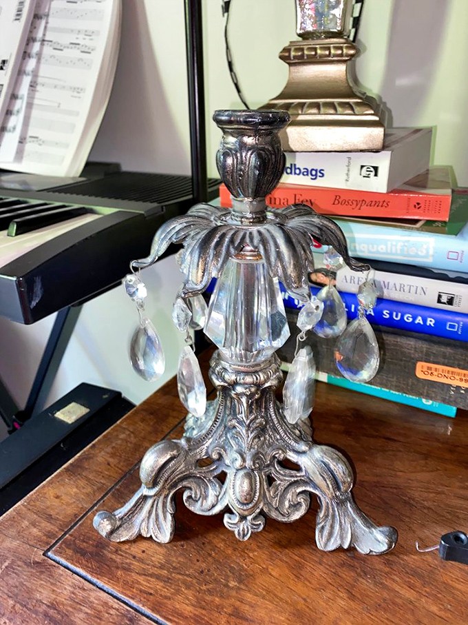 Yesterday's elegance becomes today's statement piece. This ornate candelabra just needs the right bookshelf to transform a room.