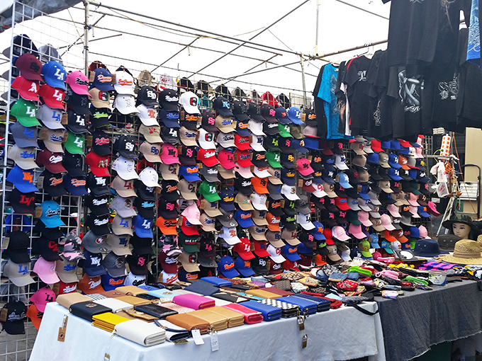 Hat-topia! This rainbow wall of headwear offers everything from sports allegiances to sun protection&mdash;identity and utility for just a few bucks.