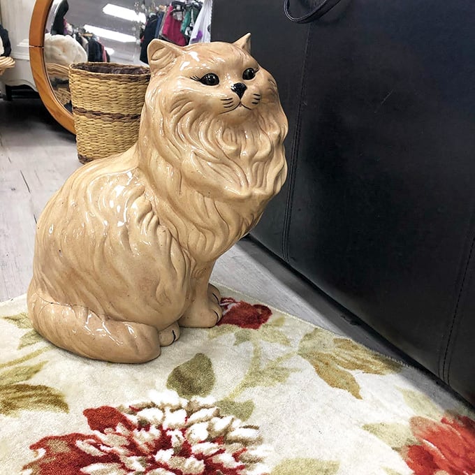 This ceramic cat figurine has seen things. Now it waits patiently to become either your most ironic or most cherished possession.