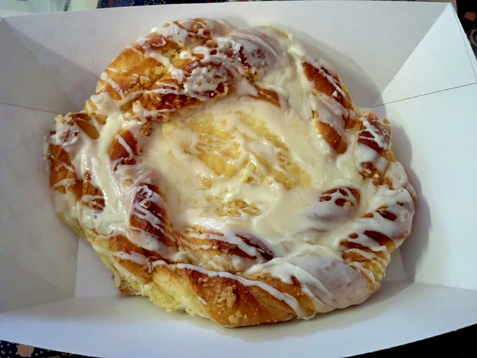That cheese danish with its spiral design and sweet glaze is basically edible architecture at its finest.