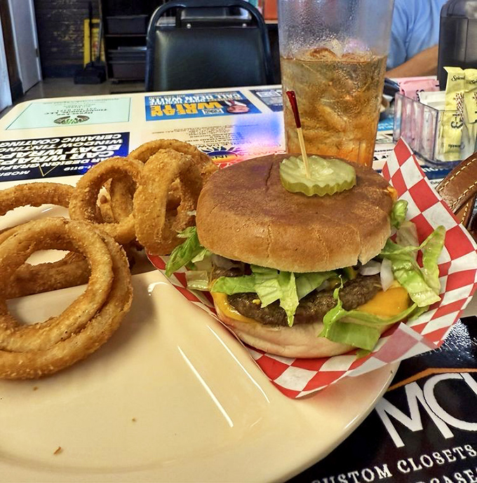That cheeseburger with lettuce, tomato, and pickle sits alongside onion rings that achieved the golden-brown perfection we all seek in life.