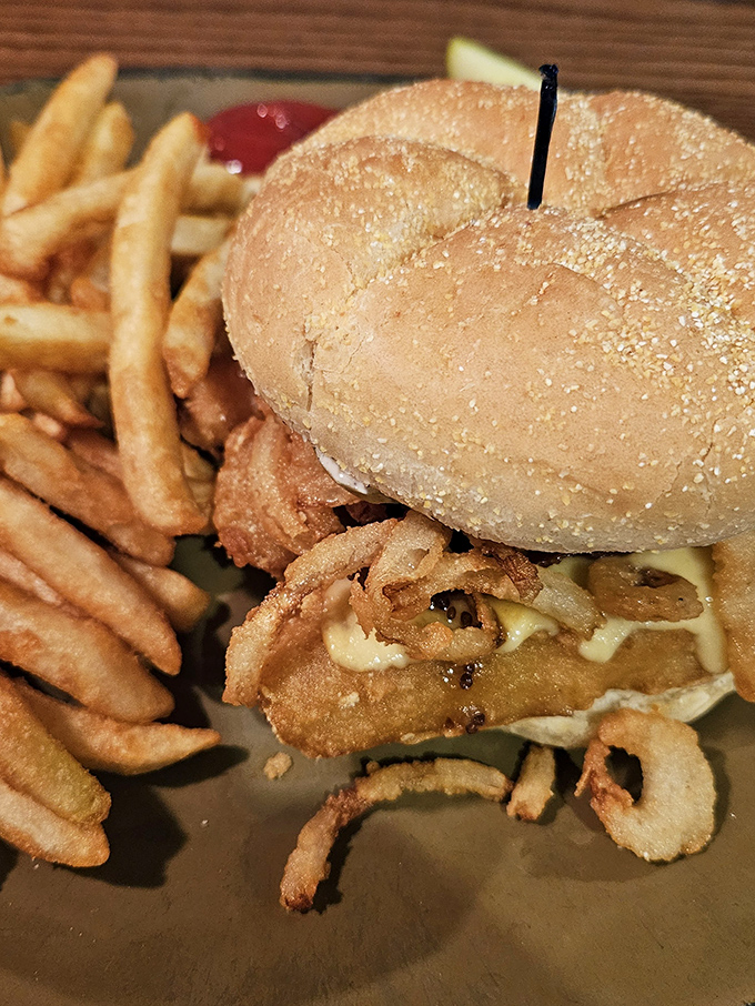 This isn't just a sandwich; it's a towering achievement of crispy, juicy goodness that requires both hands and possibly a strategy session.