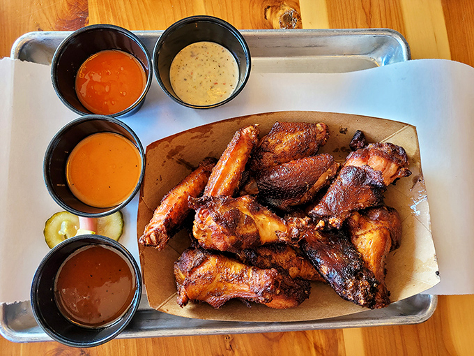 Wings surrounded by a diplomatic delegation of sauces. Each one making a compelling argument for your attention.