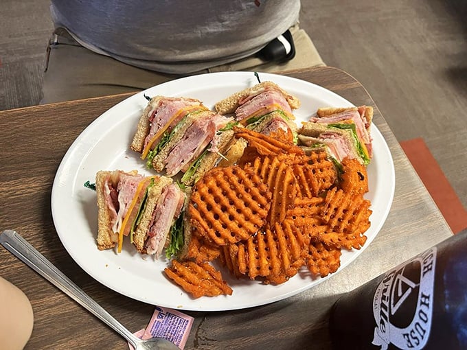 This club sandwich isn't messing around&mdash;triple-decker architecture with sweet potato waffle fries that make regular fries question their life choices.