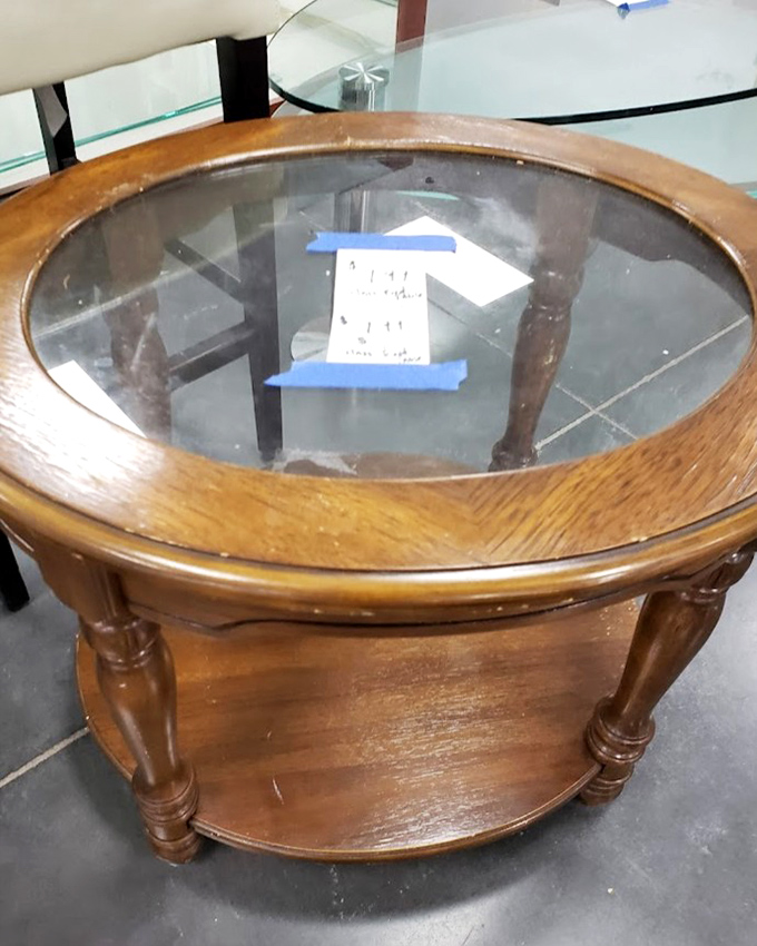 Not just a table&mdash;a conversation piece with history. This glass-top beauty awaits a second act in someone's living room drama.