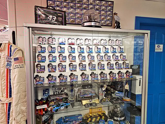 Racing history behind glass. This carefully curated collection of memorabilia tells the story of NASCAR's evolution through the decades.