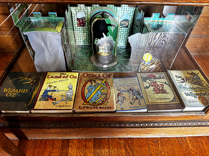 A treasure trove of L. Frank Baum's literary magic sits protected behind glass, showcasing the books that started our collective journey to Oz.