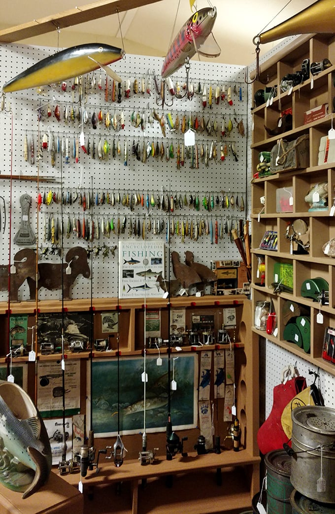 A fisherman's dream wall—vintage lures that caught both fish and collectors. Some still work; all tell tales of lakes long ago.