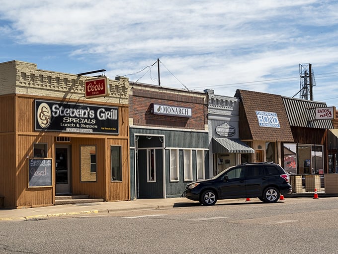 This commercial block hasn't surrendered to franchise uniformity&mdash;each storefront tells its own story rather than corporate headquarters'.